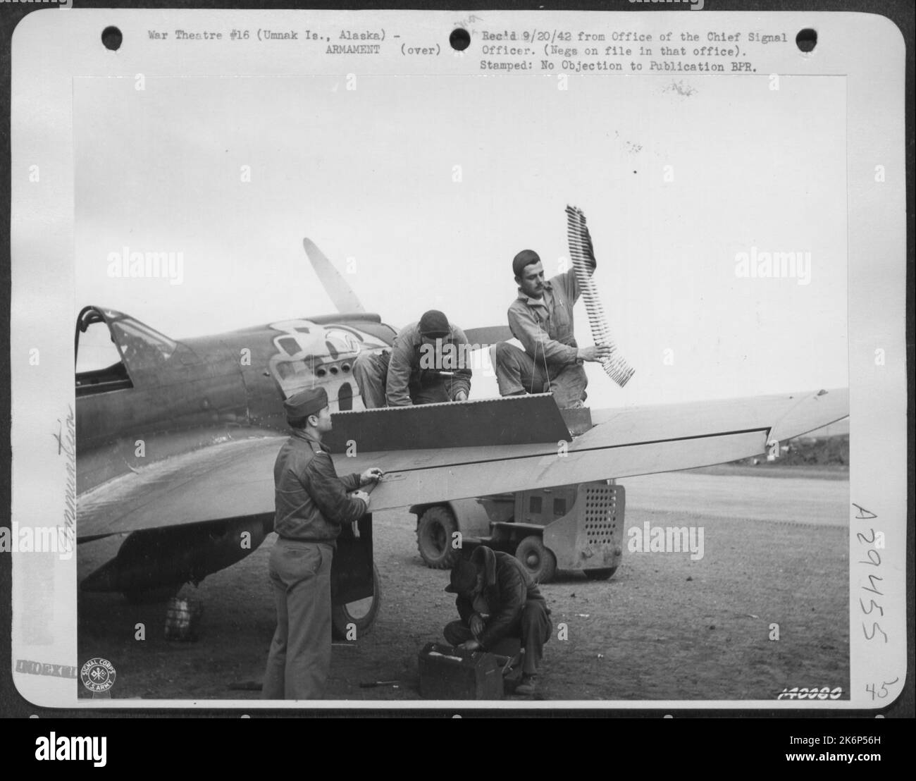 Loading a "Flying Tiger" P-40 with 50 cal. Machine gun bullets is done ...