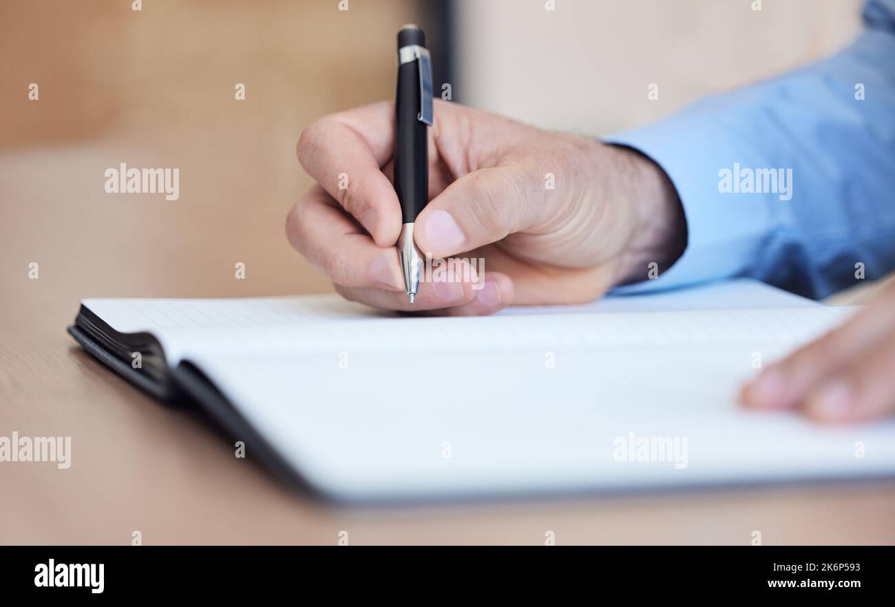 Put it all on paper. an unrecognizable businessperson writing in a ...