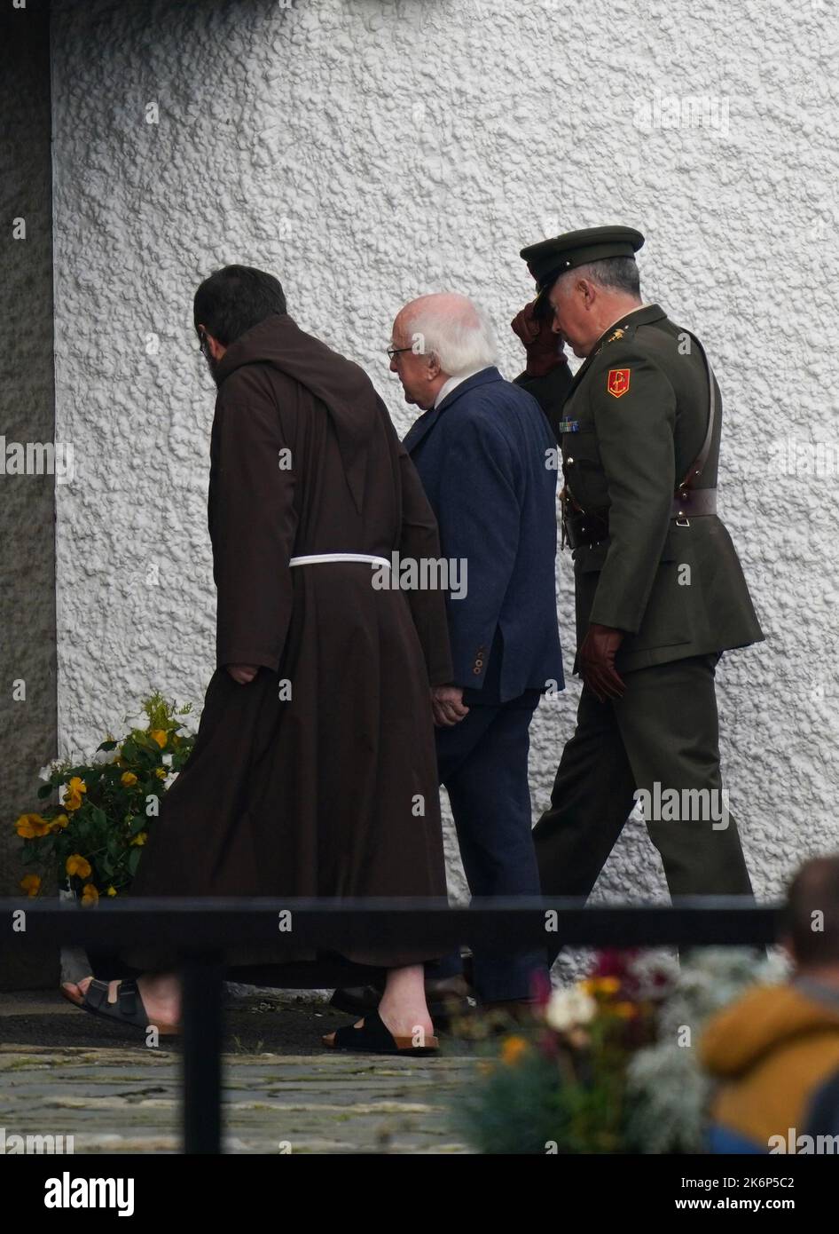 President Michael D Higgins (centre) arrives at St. Michael's Church in ...