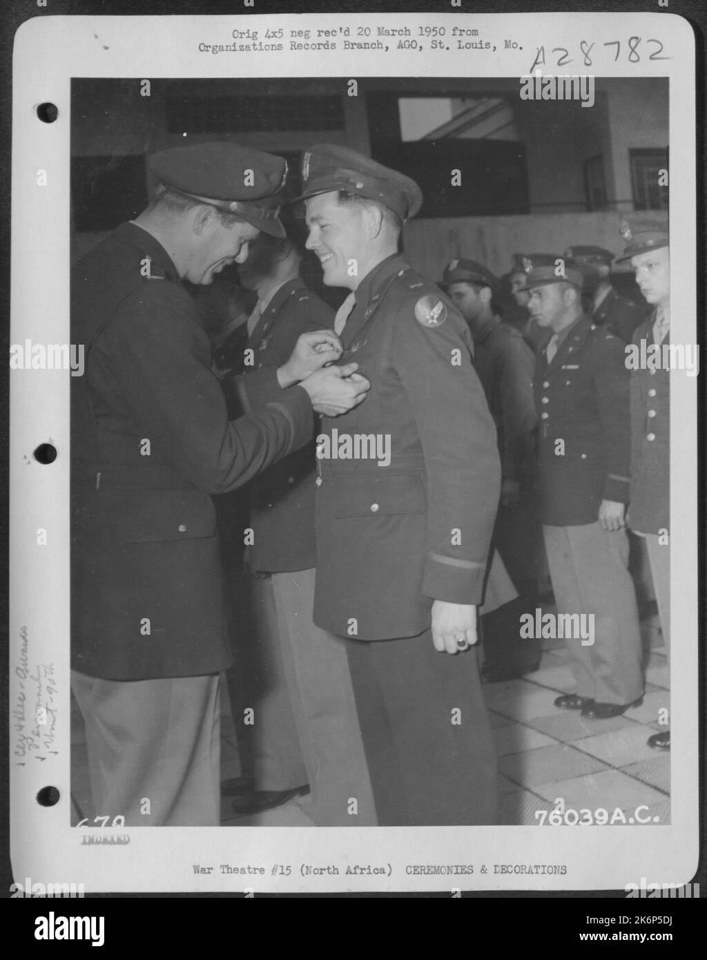 Col. Elliott Roosevelt presents an award to Lt. Silverman of the 90th ...