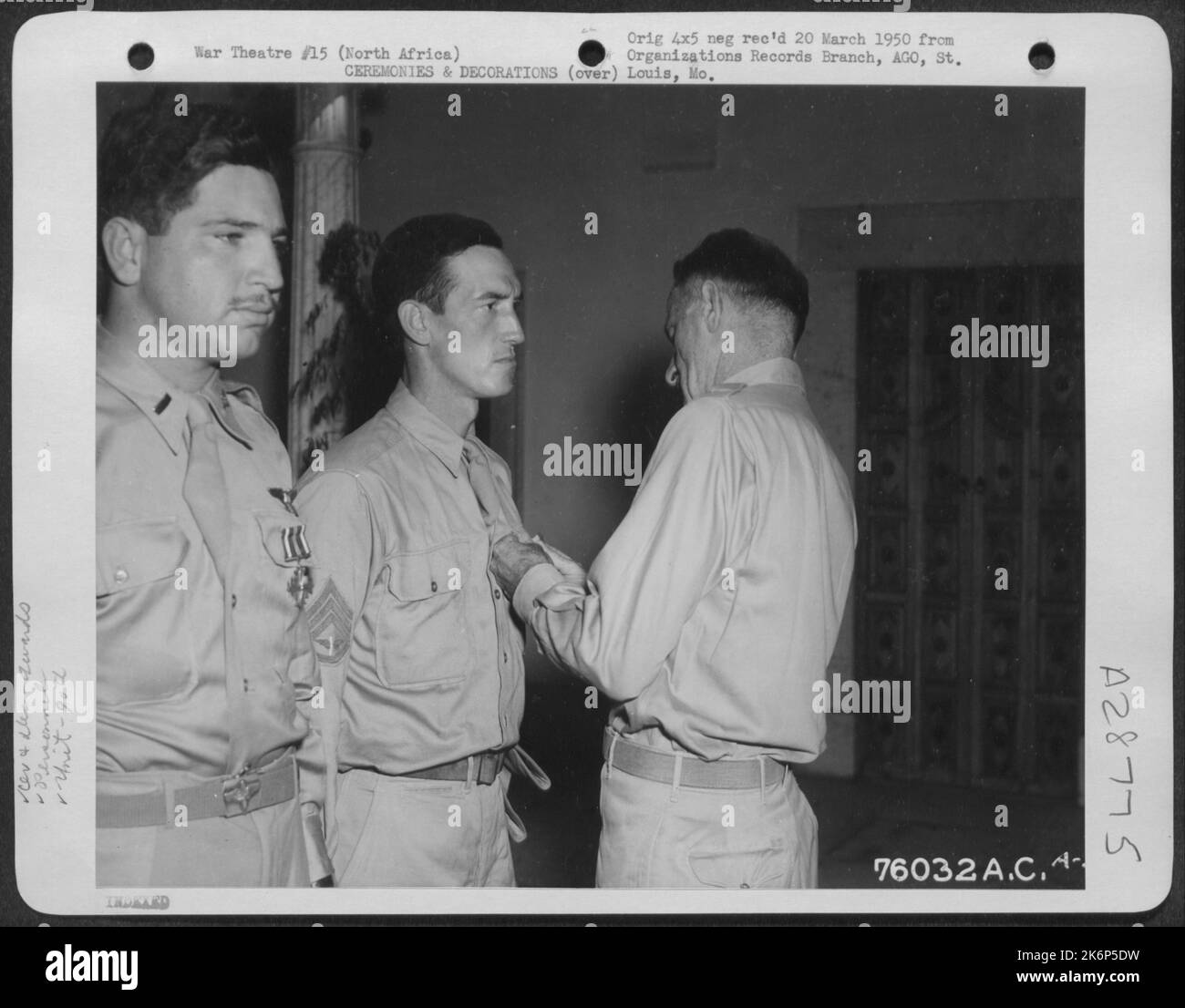 Lt. General Carl A. Spaatz presents an award to Sgt. Crosby of the 90th ...