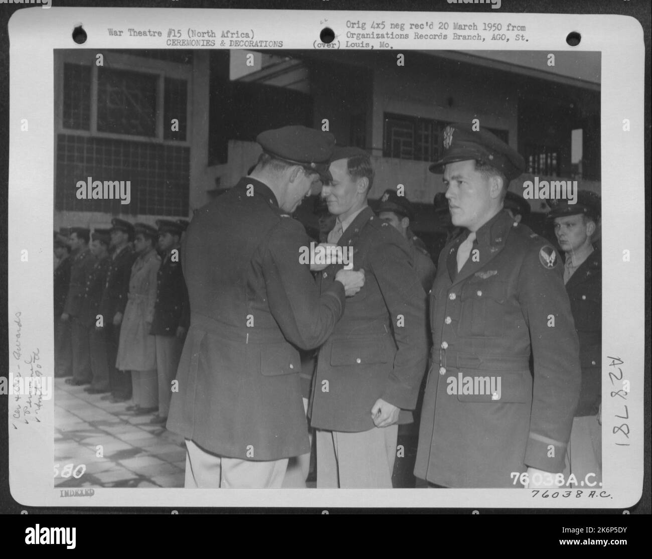 Col. Elliott Roosevelt decorates Lt. Tunnell of the 90th Photographic ...