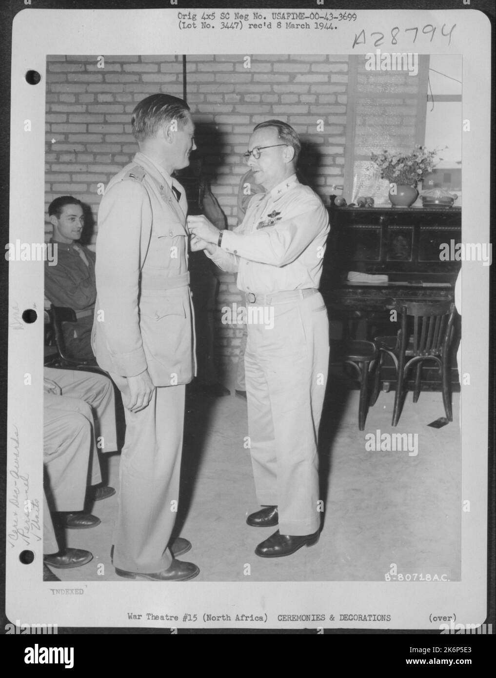 Maj. General Lewis H. Brereton presents the Purple Heart to Capt ...