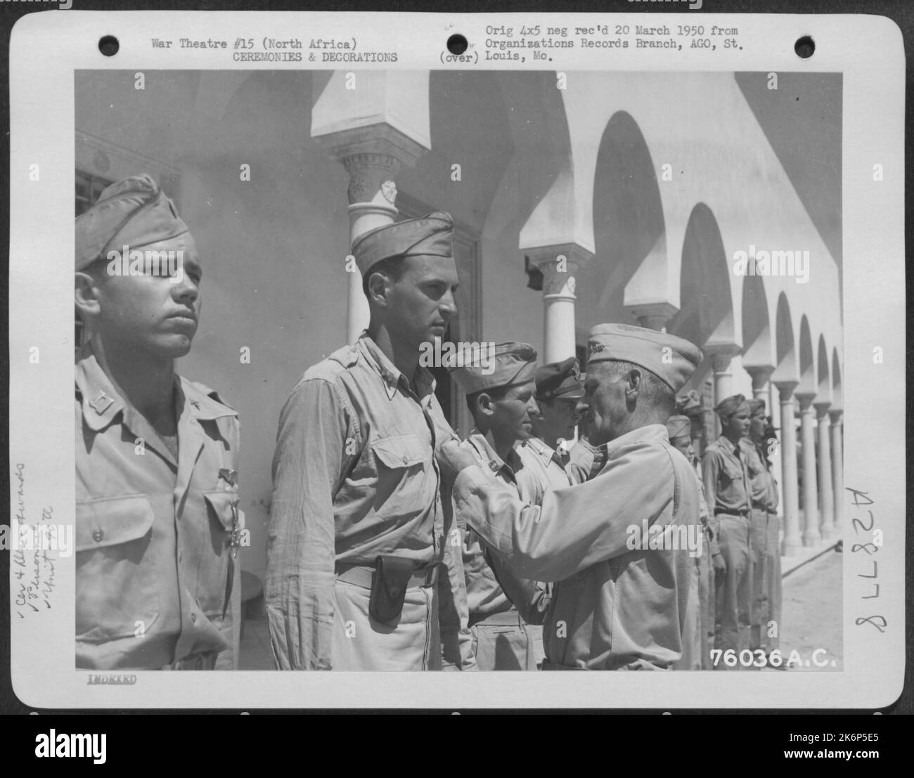 Lt. General Carl A. Spaatz presents the Distinguished Flying Cross to ...