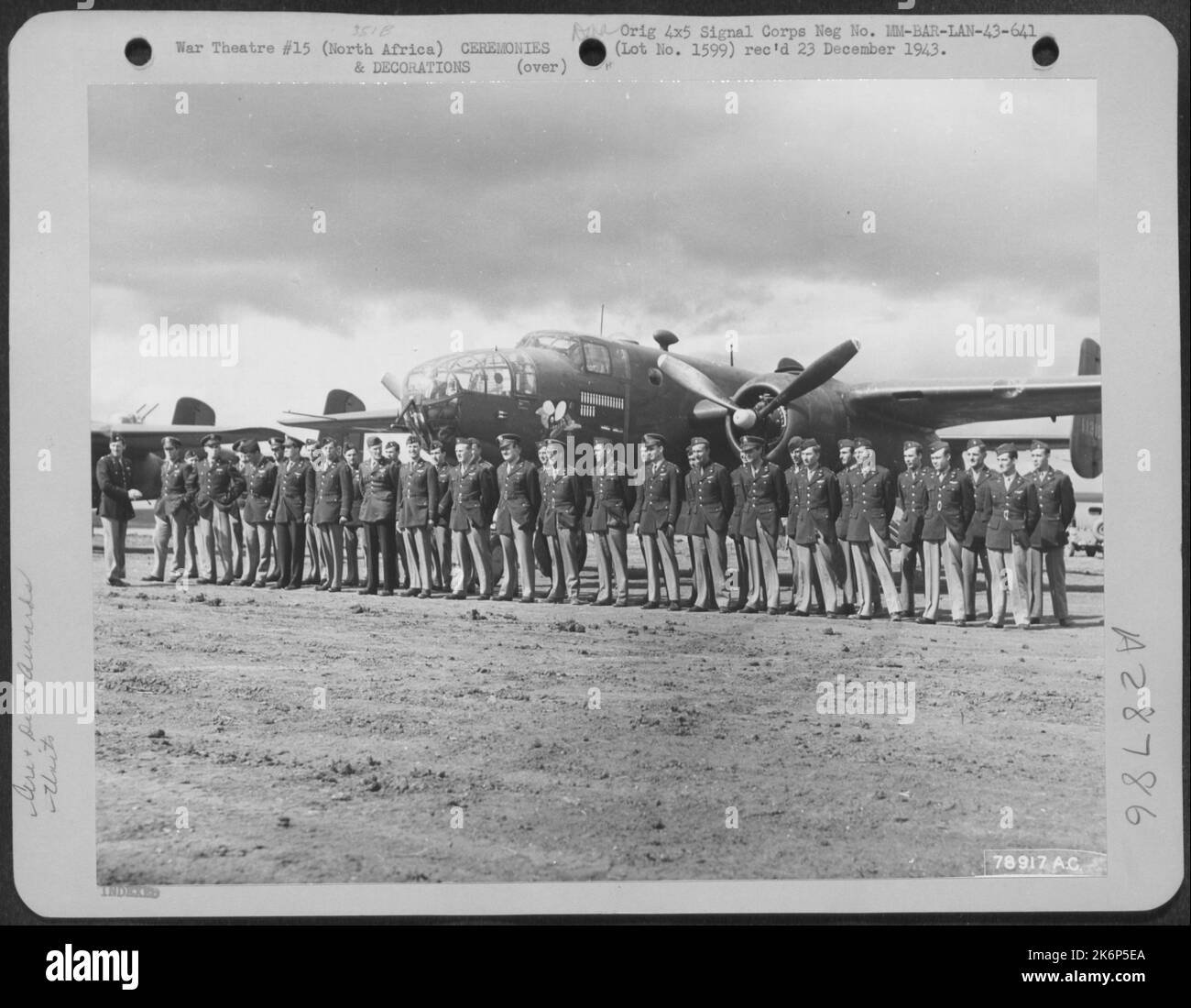 Members of the 428th Bomb Squadron, 310th Bomb Group await presentation ...