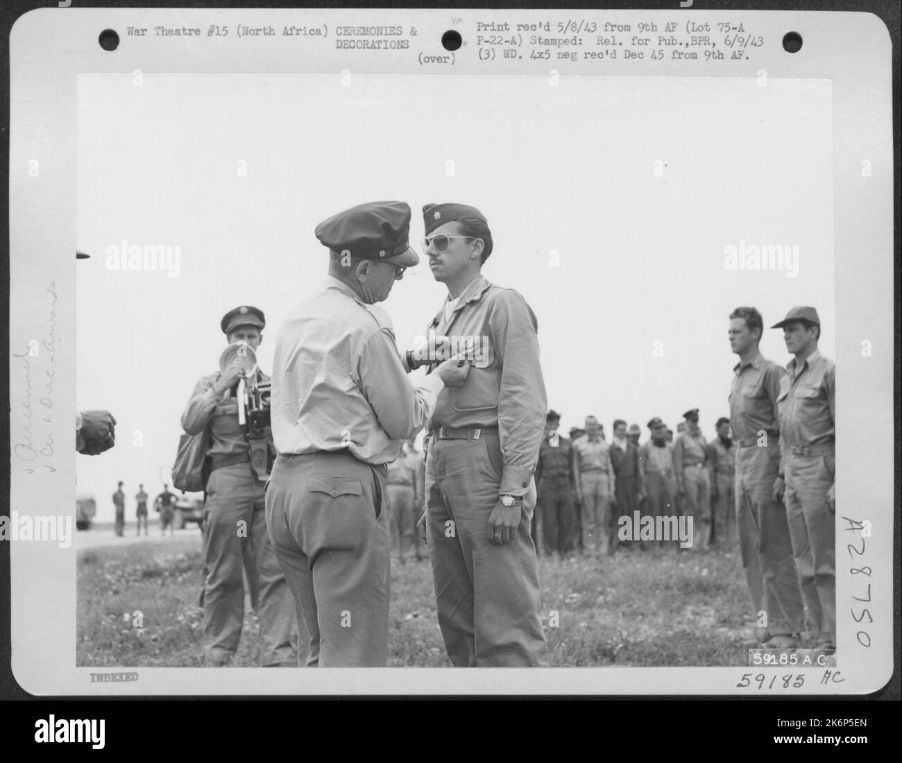 1st Lt. Harry H. Stanford, Munising, Mich., receiving the Distinguished ...