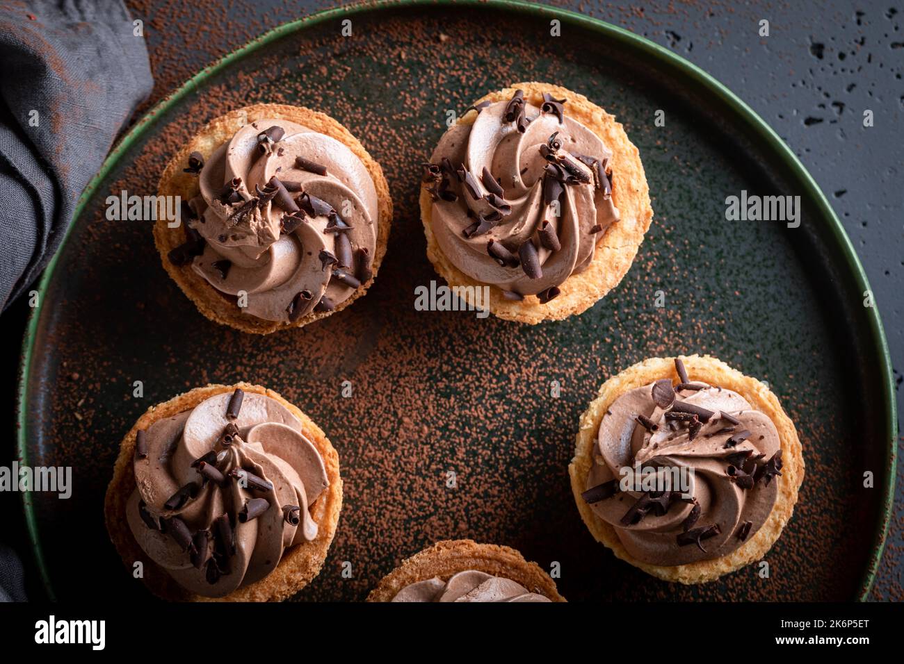 Delicious mini tartlets made of cream and shavings. Sweet dessert made ...