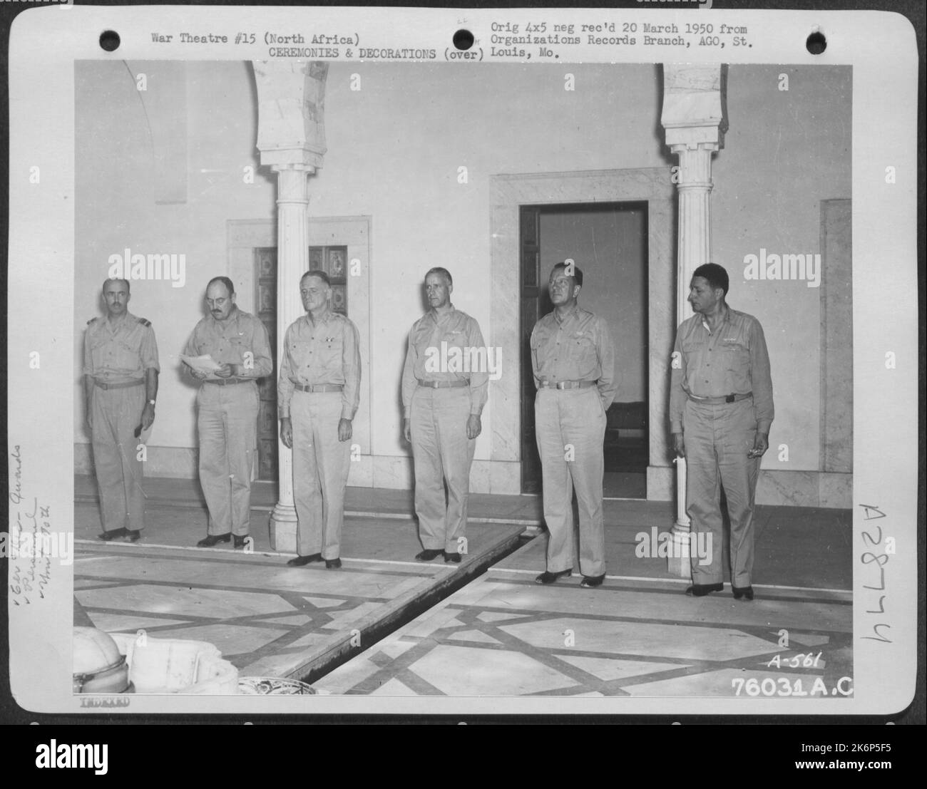Lt. General Carl A. Spaatz and his staff stand at attention while a ...