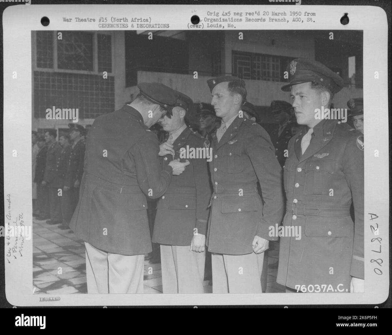 Col. Elliott Roosevelt presents an award to Lt. Craif of the 90th ...