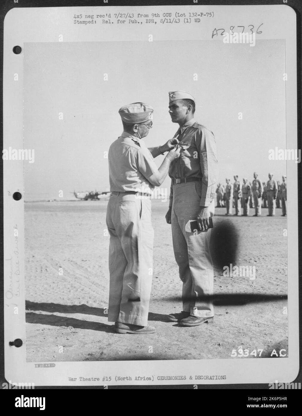 AFRICA-1st Lt. Robert H. Storz, Omaha, Neb. Receiving the DFC from Maj ...