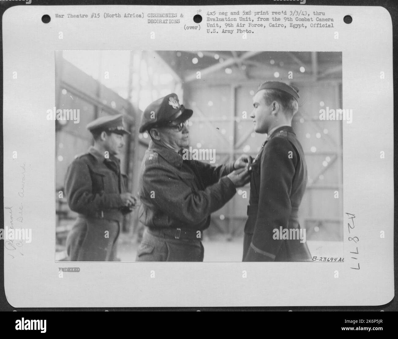 Major General Lewis H. Brereton decorating Capt. George A. Uhrich, 9 ...