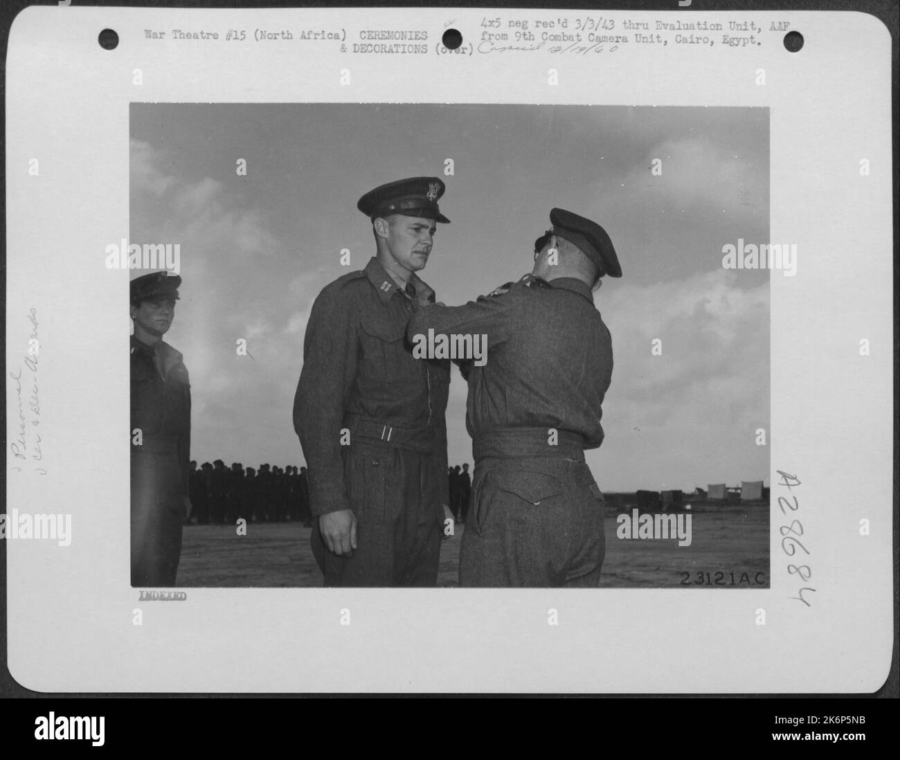 Major Gen. Lewis H. Brereton presents Capt. Ramsay D. Potts, Jr., with ...
