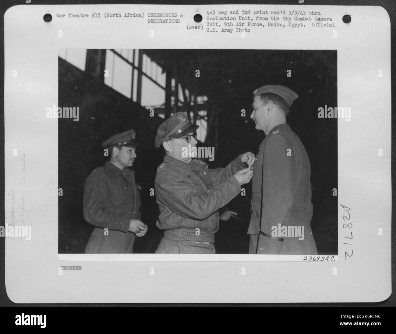 Major Gen. Lewis H. Brereton decorating Col. George F. McGuire, 0-18008 ...