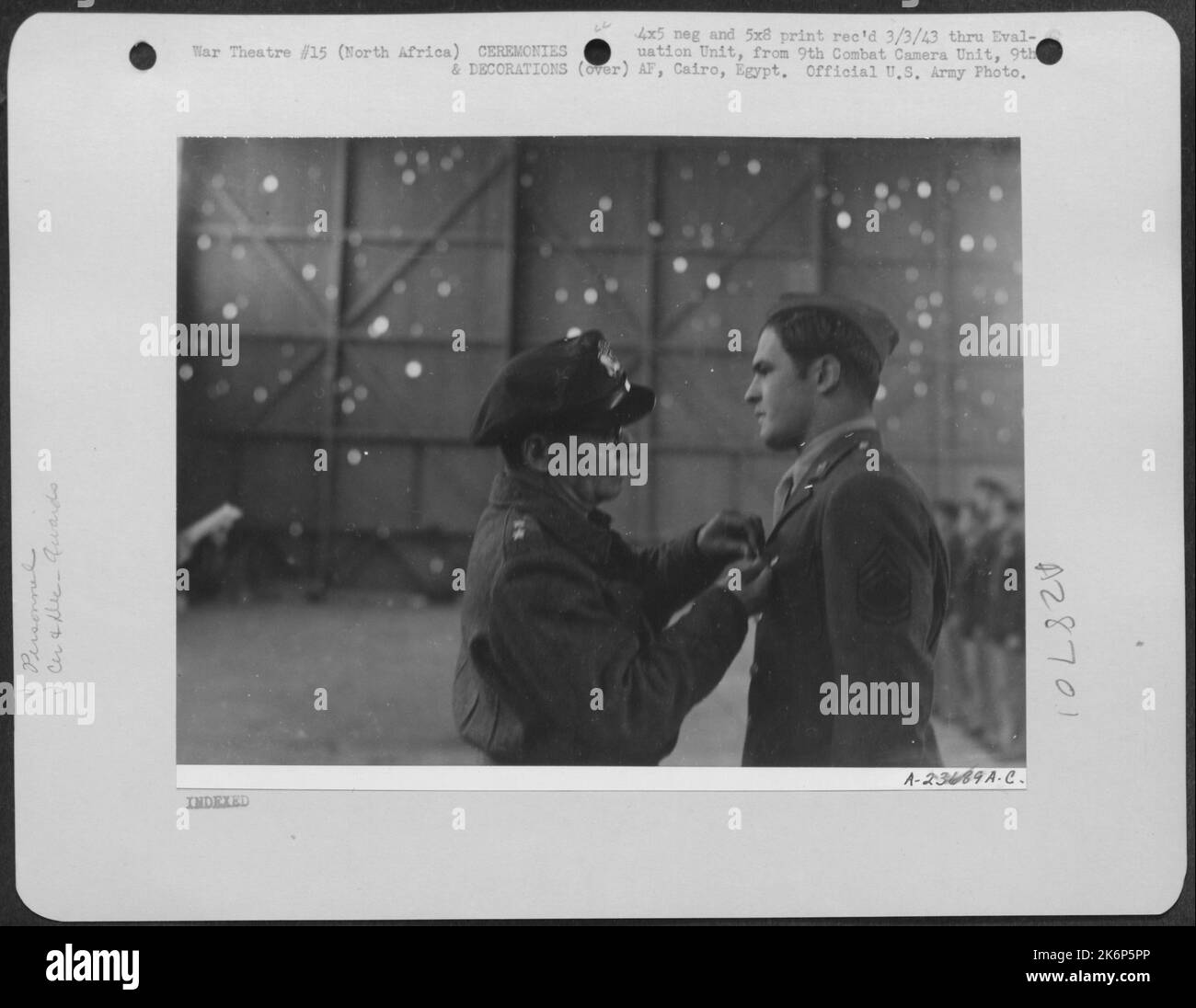 Major General Lewis H. Brereton presenting T/Sgt. Albert S. Fisher ...