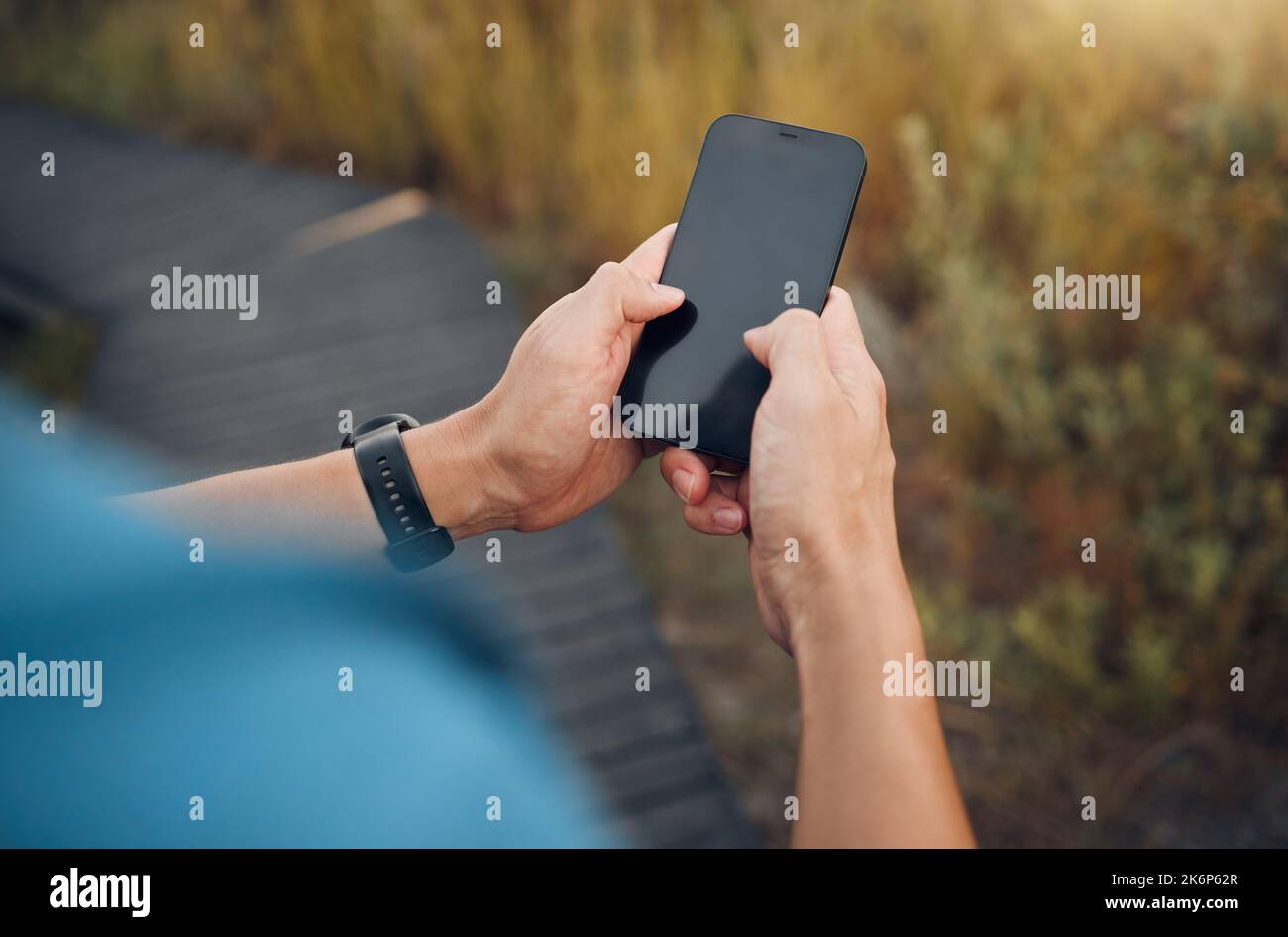 Fitness, hands and mockup phone screen of runner exercising in nature ...