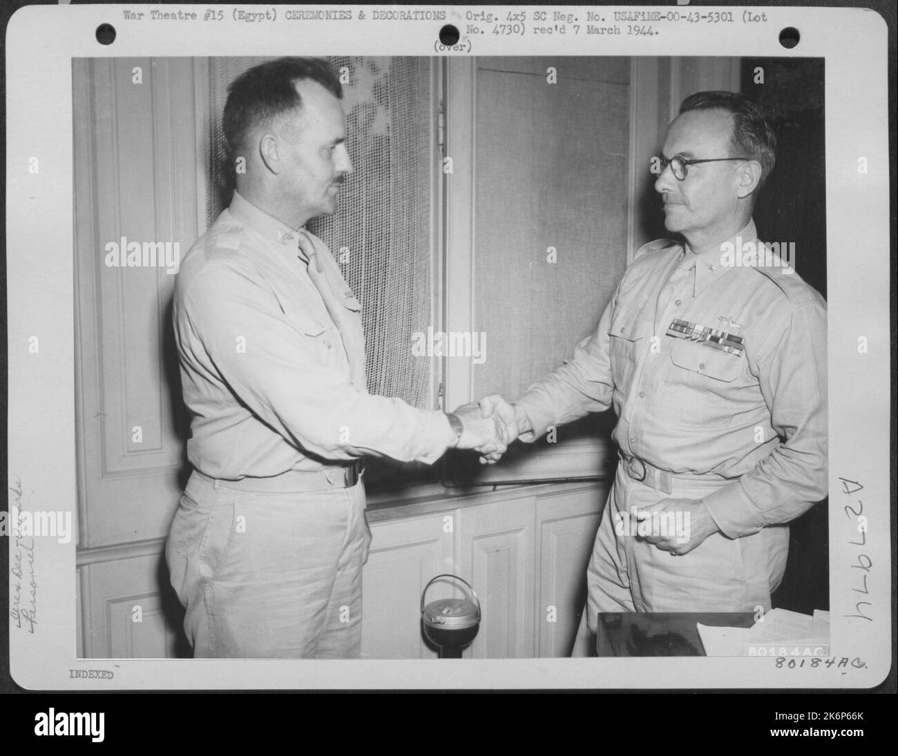 Major General Lewis H. Brereton congratulates Col. Crawford F. Sams ...