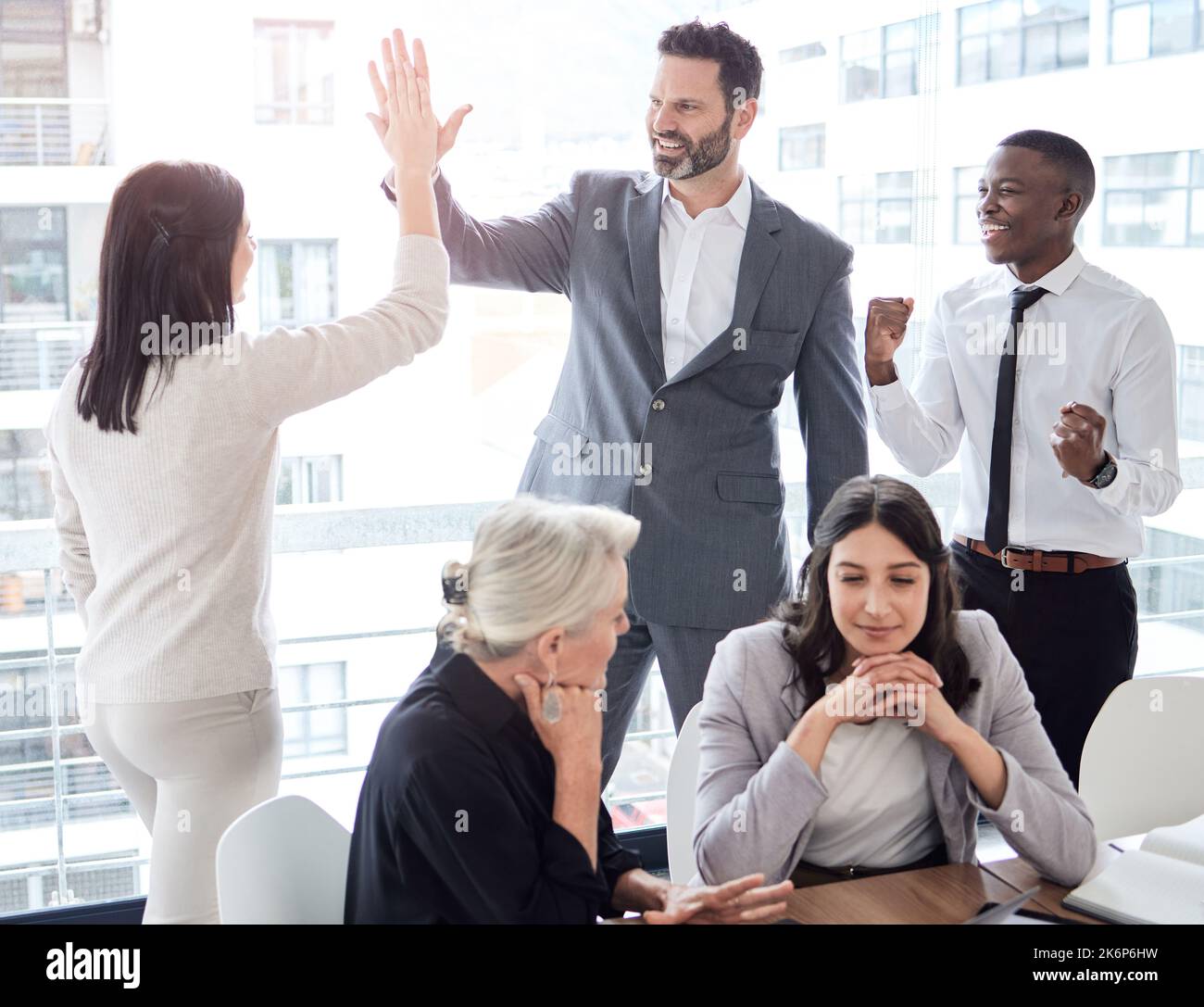 Success comes from helping each other. a group of businesspeople ...