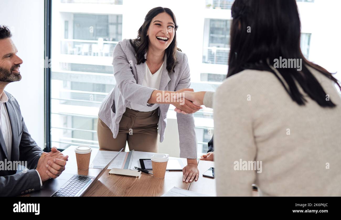 More connections to be made. two businesspeople shaking hands in a ...