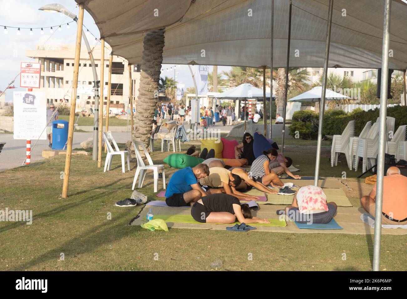 Haifa, Israel - Ocrober 14, 2022, People doing yoga on Bat Galim beach ...