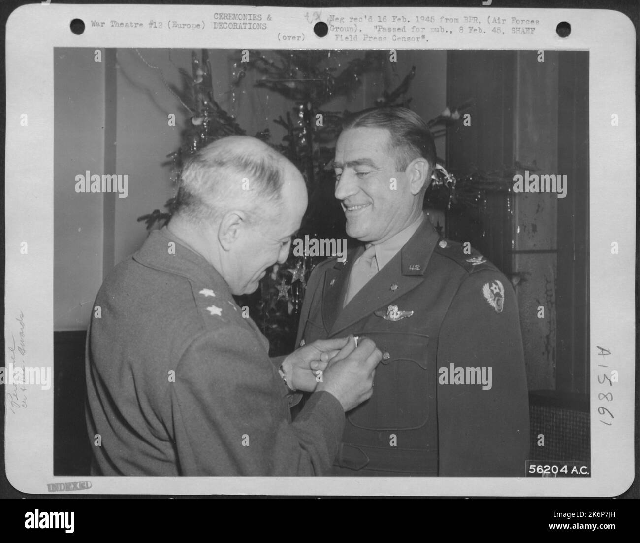 Maj. Gen. Ralph Royce pins the Legion of Merit on Col. Ralph E. Fisher ...