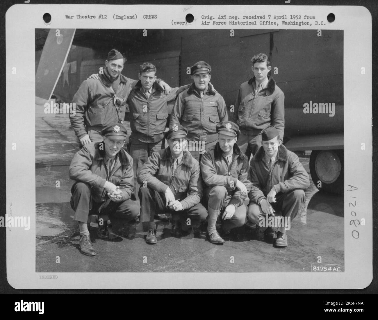 Crew Members Pose Beside A Consolidated B-24 Somewhere In England Stock ...