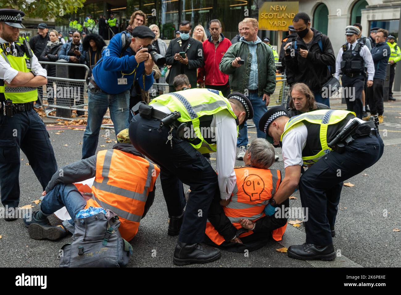 London, UK. 14th October, 2022. Metropolitan Police officers arrest a ...