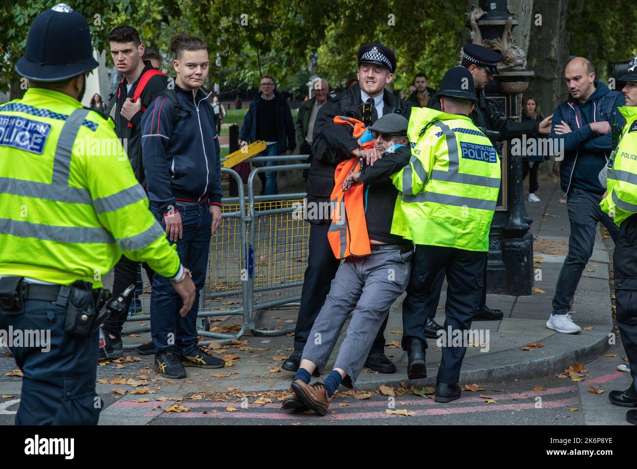 London, UK. 14th October, 2022. Metropolitan Police officers arrest a ...