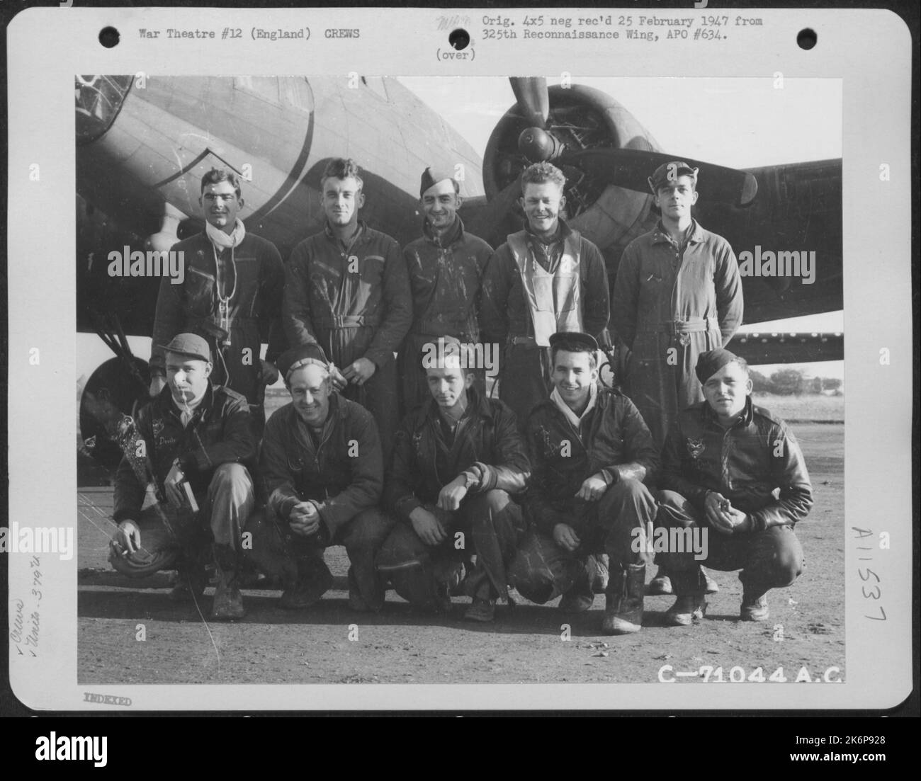 A Crew Of The 379Th Bomb Group Poses Beside A Boeing B-17 "Flying ...