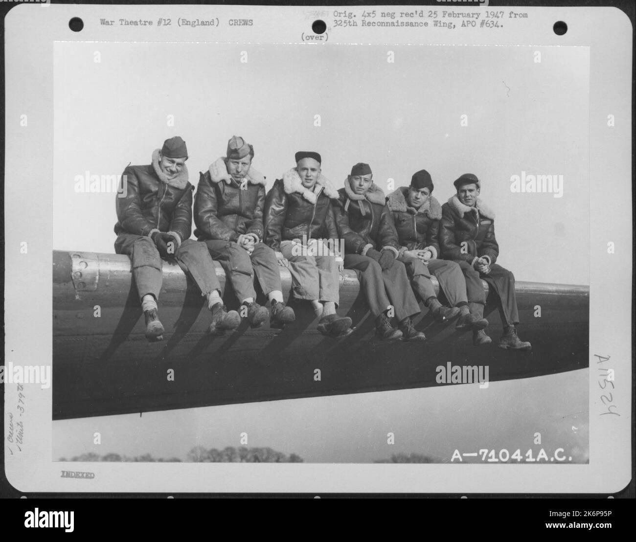 A Crew Of The 379Th Bomb Group Poses Beside A Boeing B-17 "Flying ...