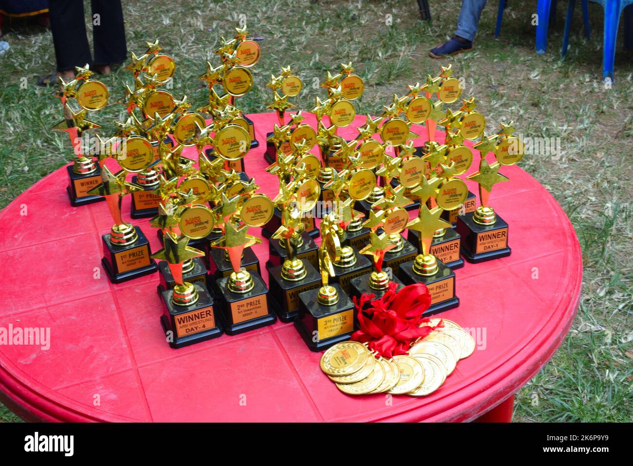 A table full of trophies to be distributed to the winner at competition ...