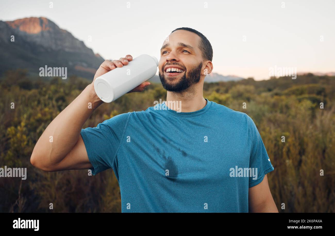 Runner, mountain nature and man drinking water after running. Break ...
