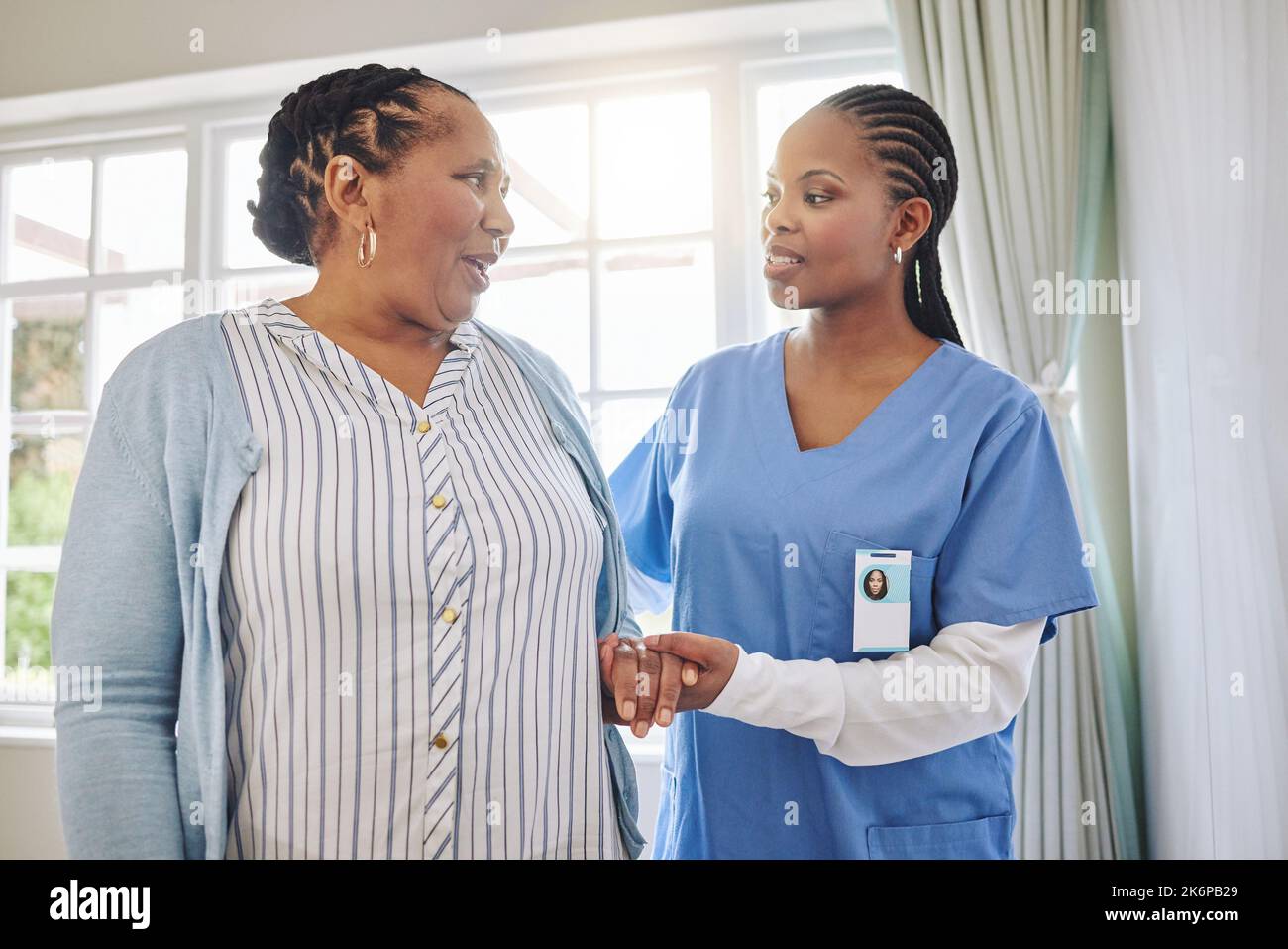 Absolutely, positively happy. a nurse speaking to her female patient ...