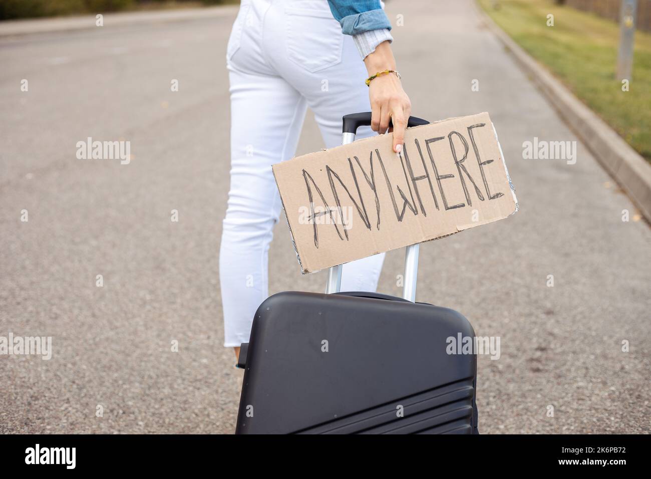 Woman Walking Away From Man With Suitcase