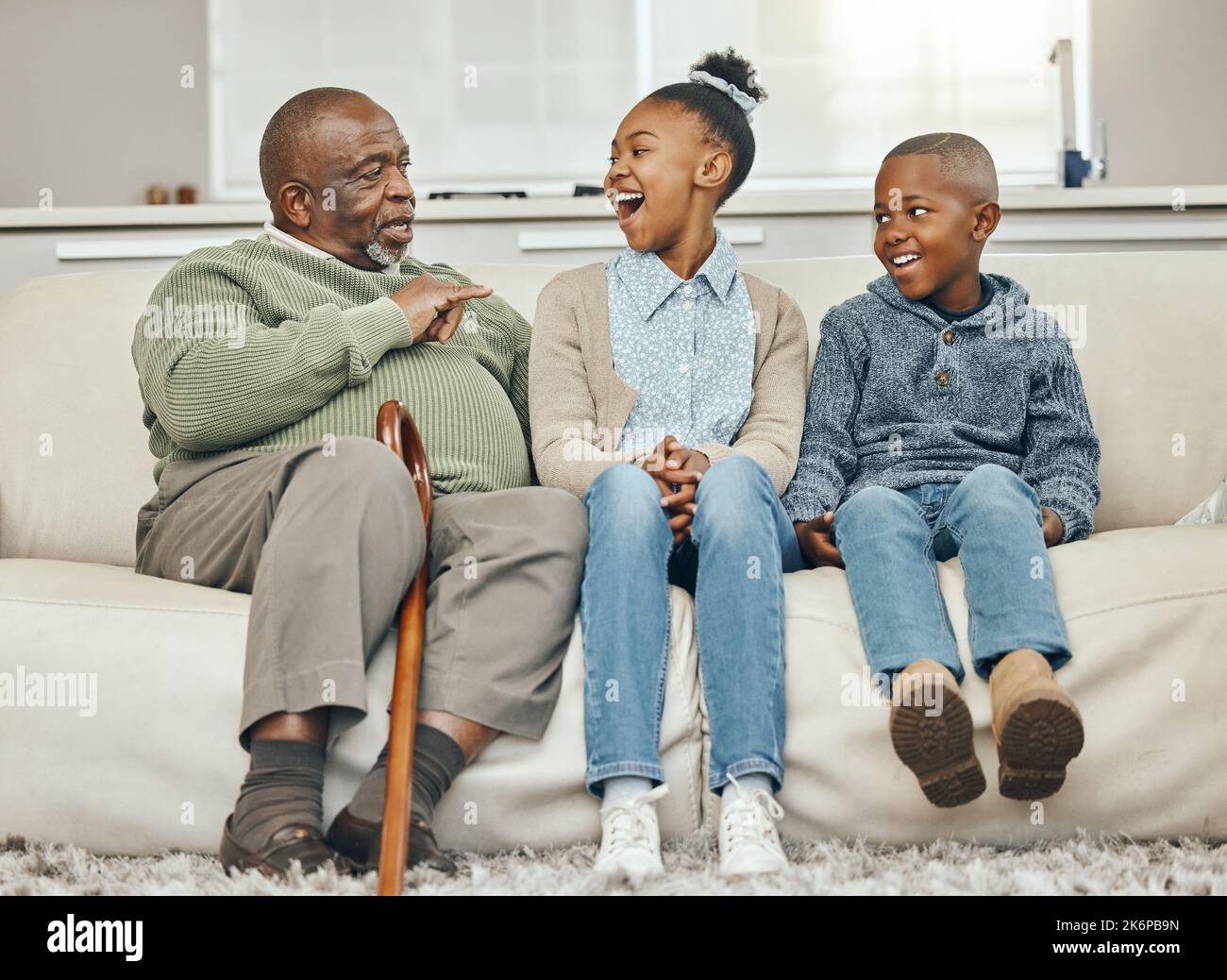 The strongest bond. a grandfather bonding with his grandkids on a sofa ...