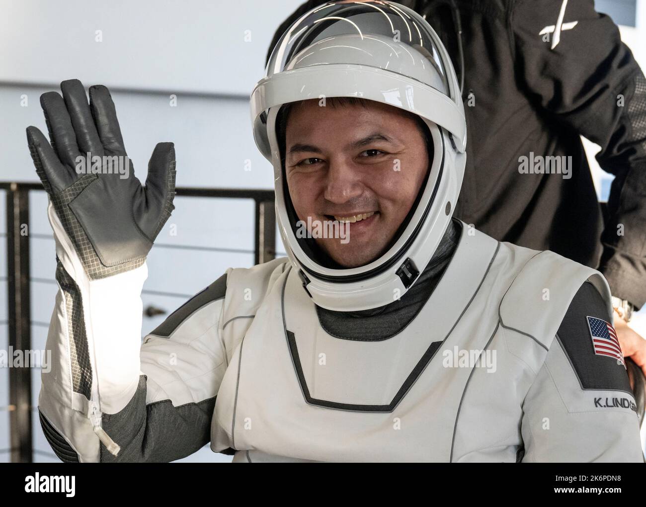 NASA astronaut Kjell Lindgren is helped out of the SpaceX Crew Dragon ...