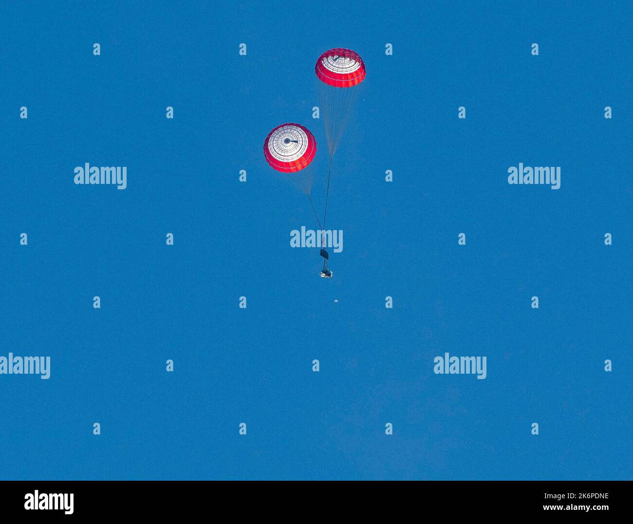 The drogue parachutes of the SpaceX Crew Dragon Freedom spacecraft are ...