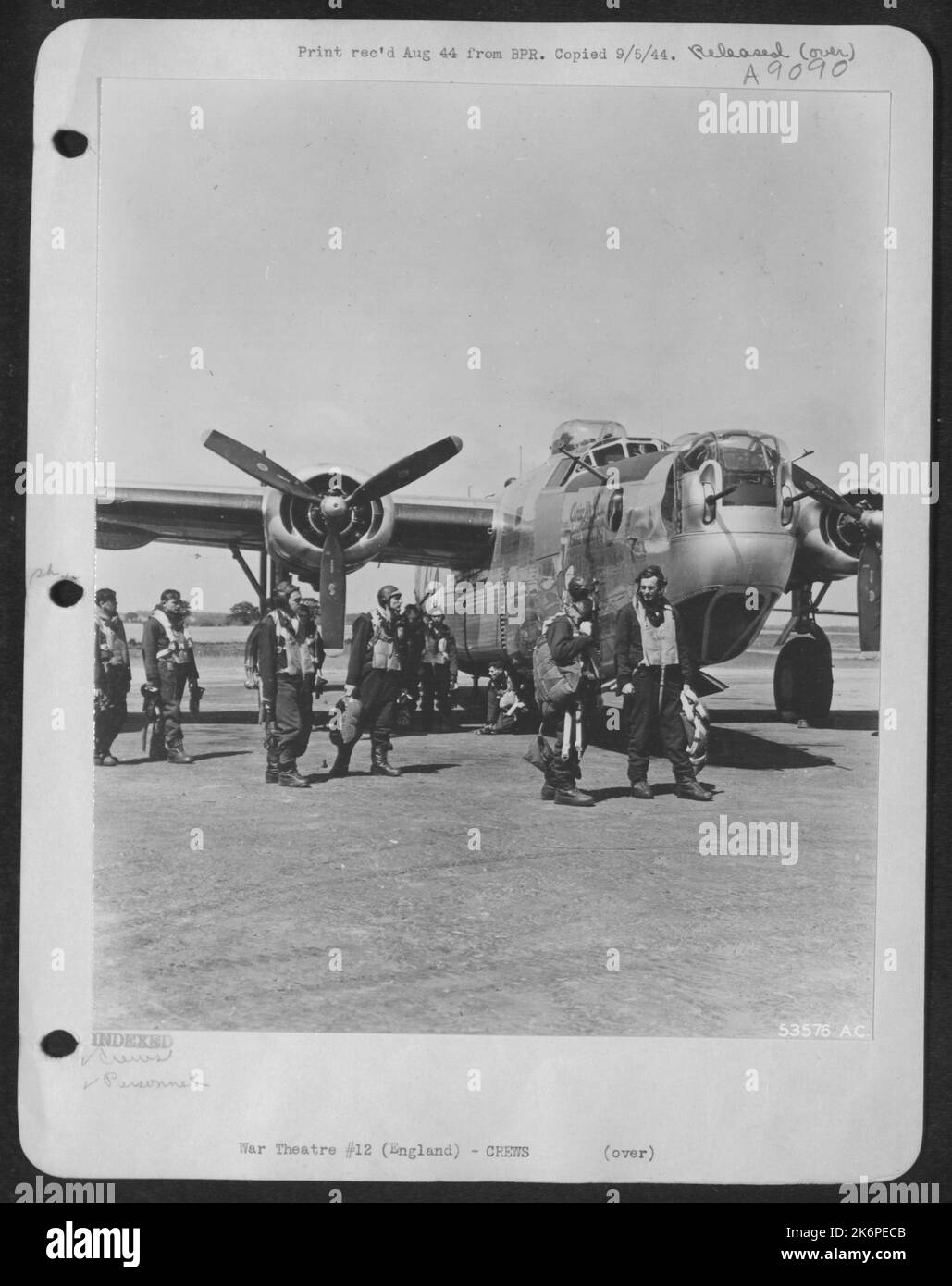 Capt. Howard W. Slaton, pilot of a B-24 Liberator, shown leading his ...
