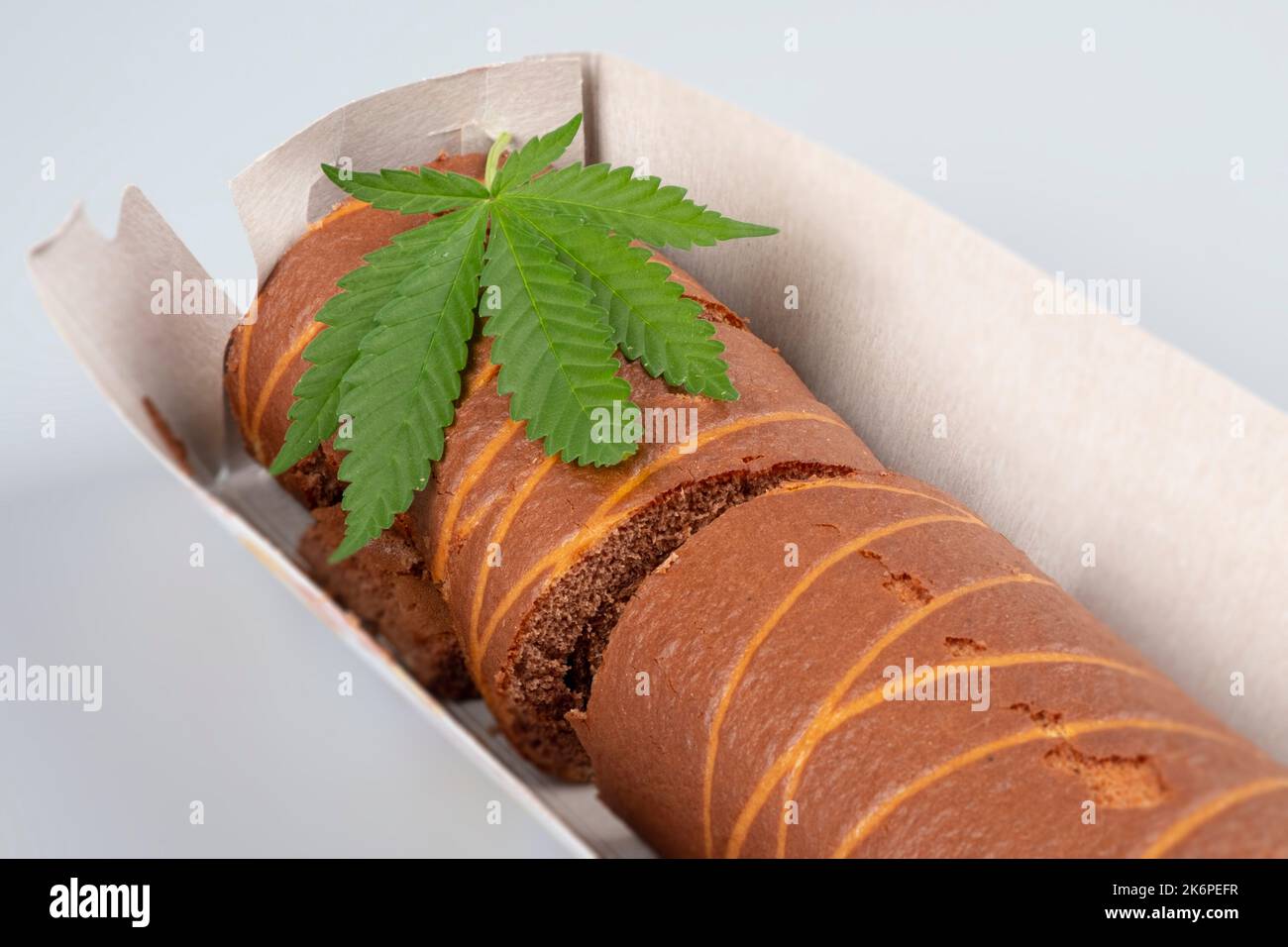 cannabis sweets, biscuit roll with thc Stock Photo - Alamy