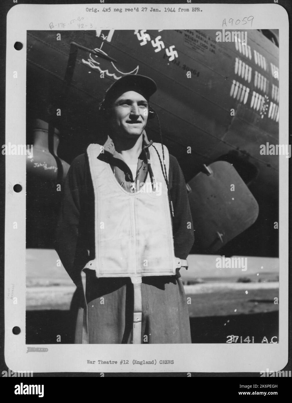 S/Sgt. Leon E. Piatek, Thorp, Wisconsin poses beside a plane at an air ...
