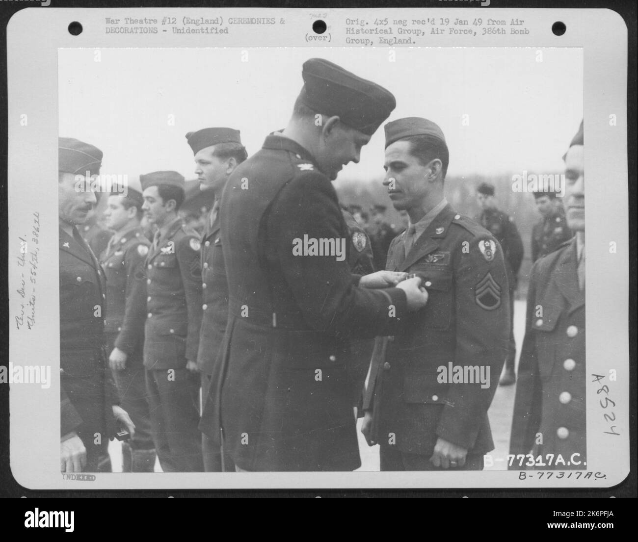 A Member Of The 554Th Bomb Squadron, 386Th Bomb Group Receives An Award ...