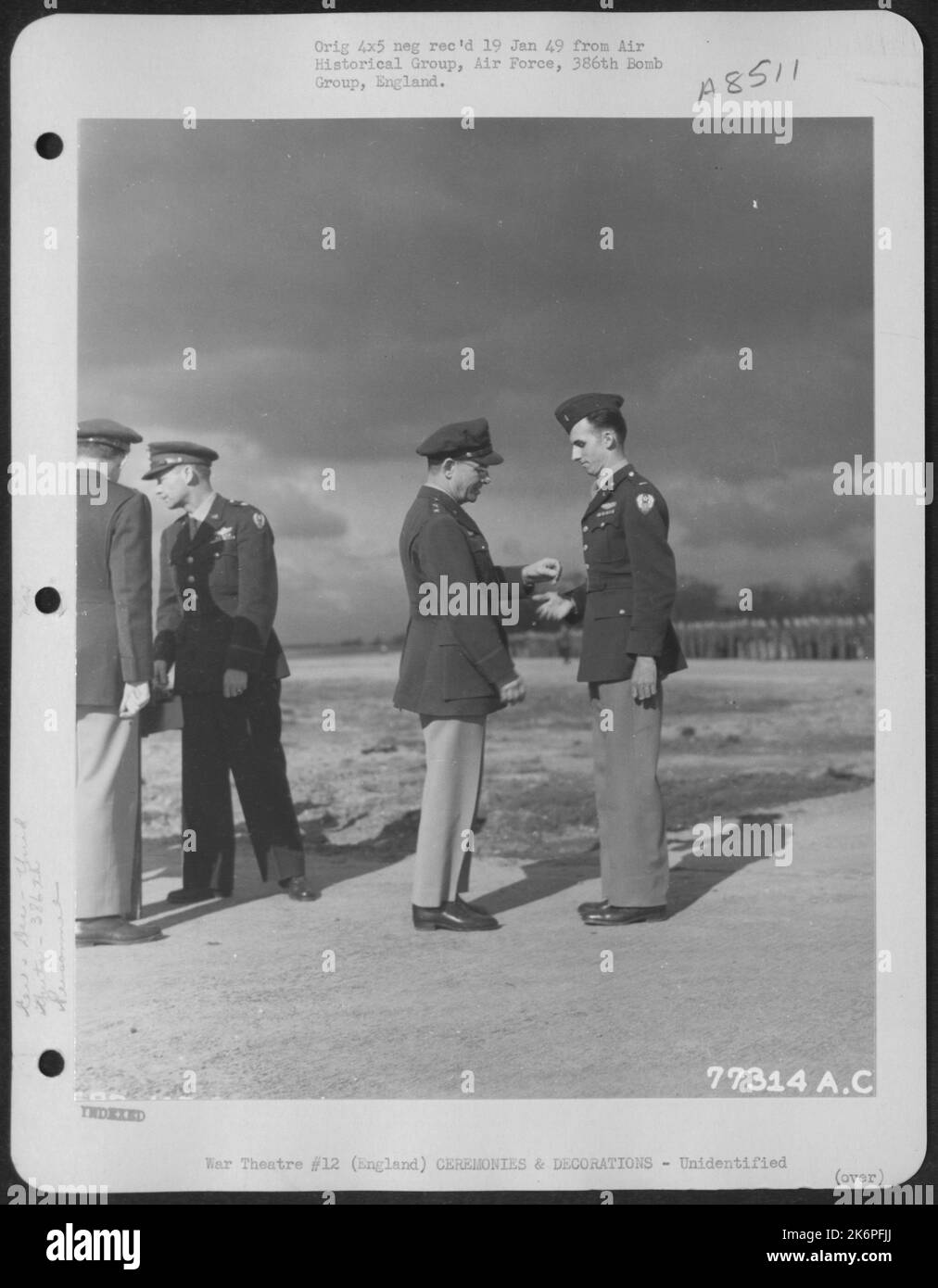 Major General Lewis H. Brereton Congratulates A Member Of The 386Th ...