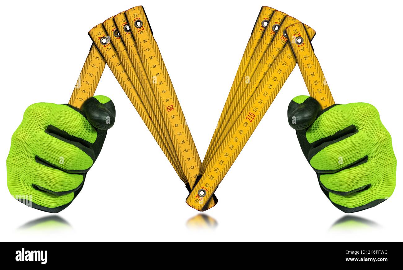 Manual worker with work gloves, holding an old orange folding ruler in ...