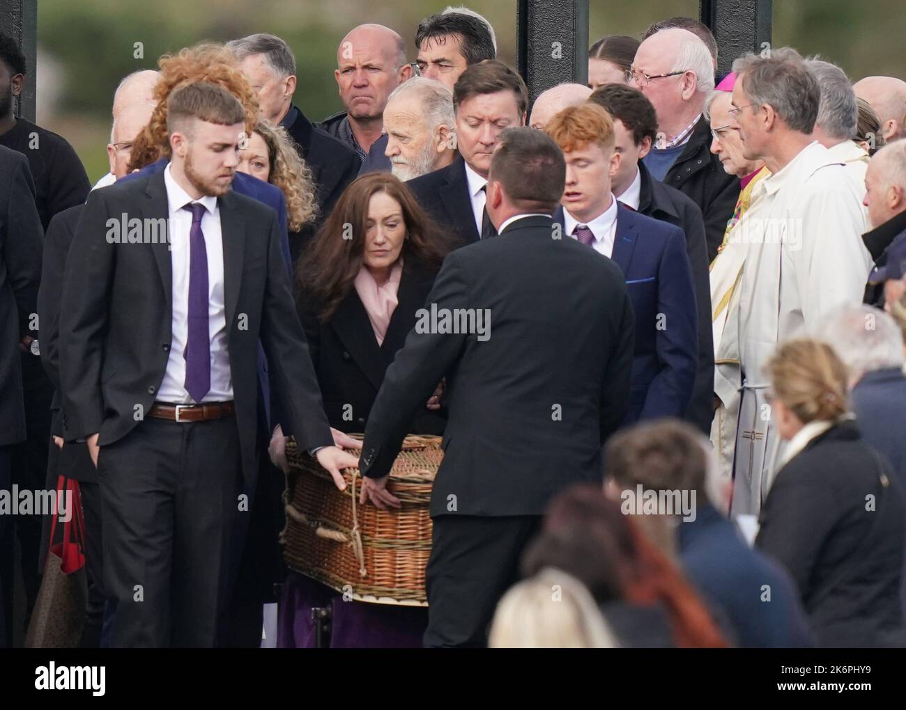 Robert Garwe's partner Aine pushes her daughters coffin from St Michael ...