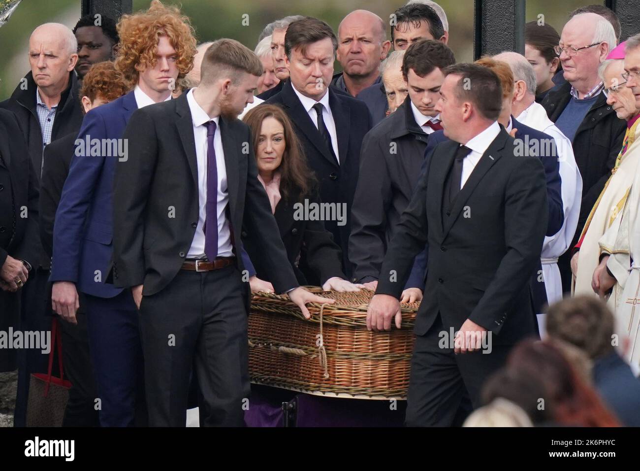 Robert Garwe's partner Aine pushes her daughters coffin from St Michael ...