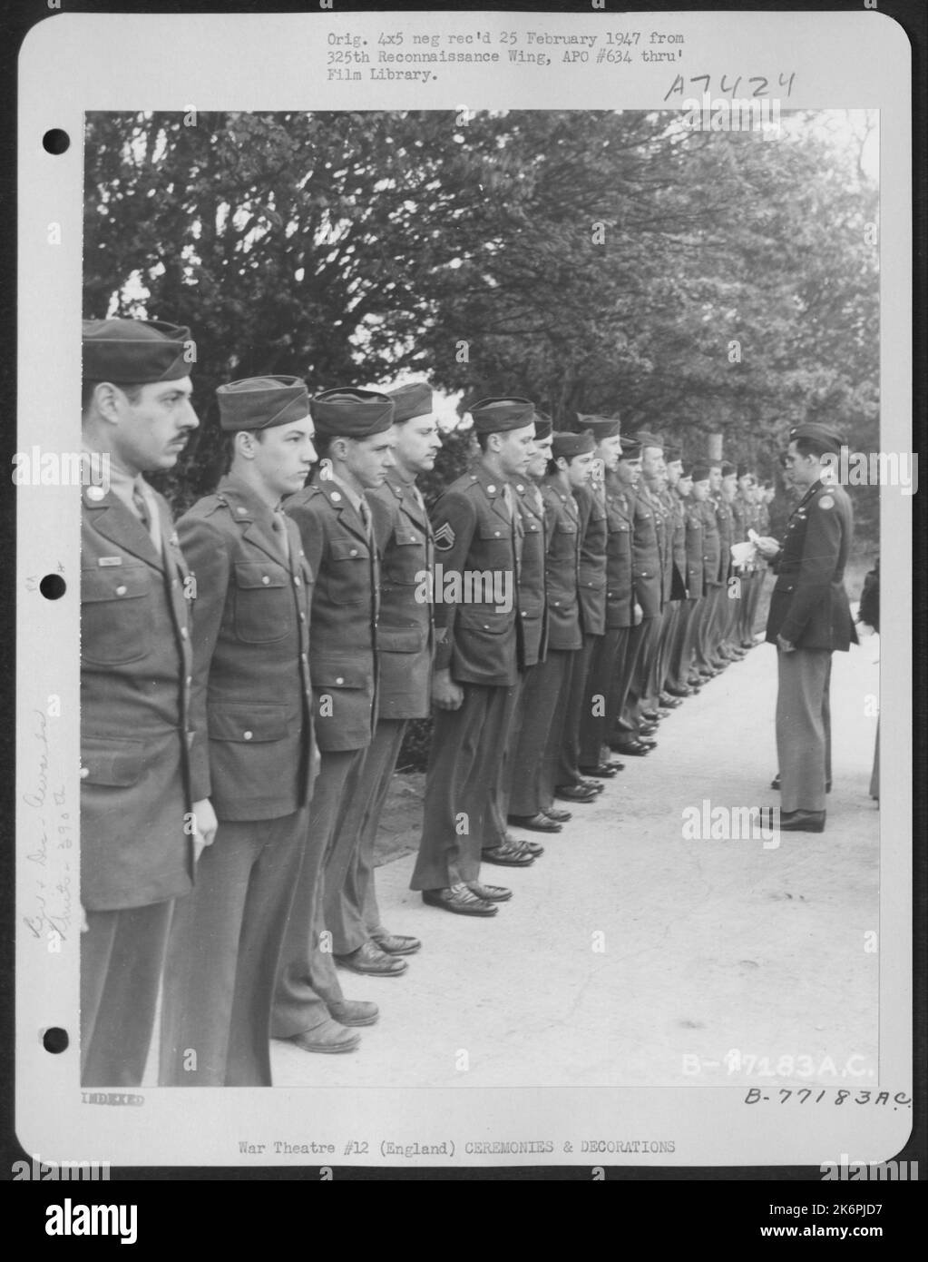 Members Of The 390Th Bomb Group, Standing In Formation, Await ...