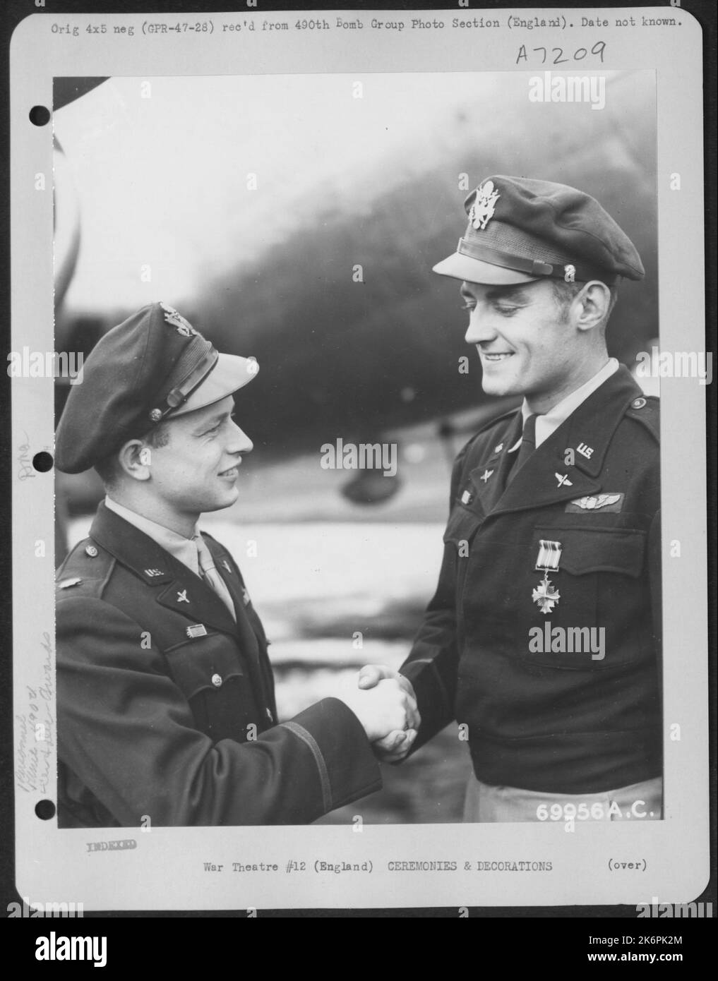 Lt. Simpson Of The 490Th Bomb Group Is Presented The Distinguished ...