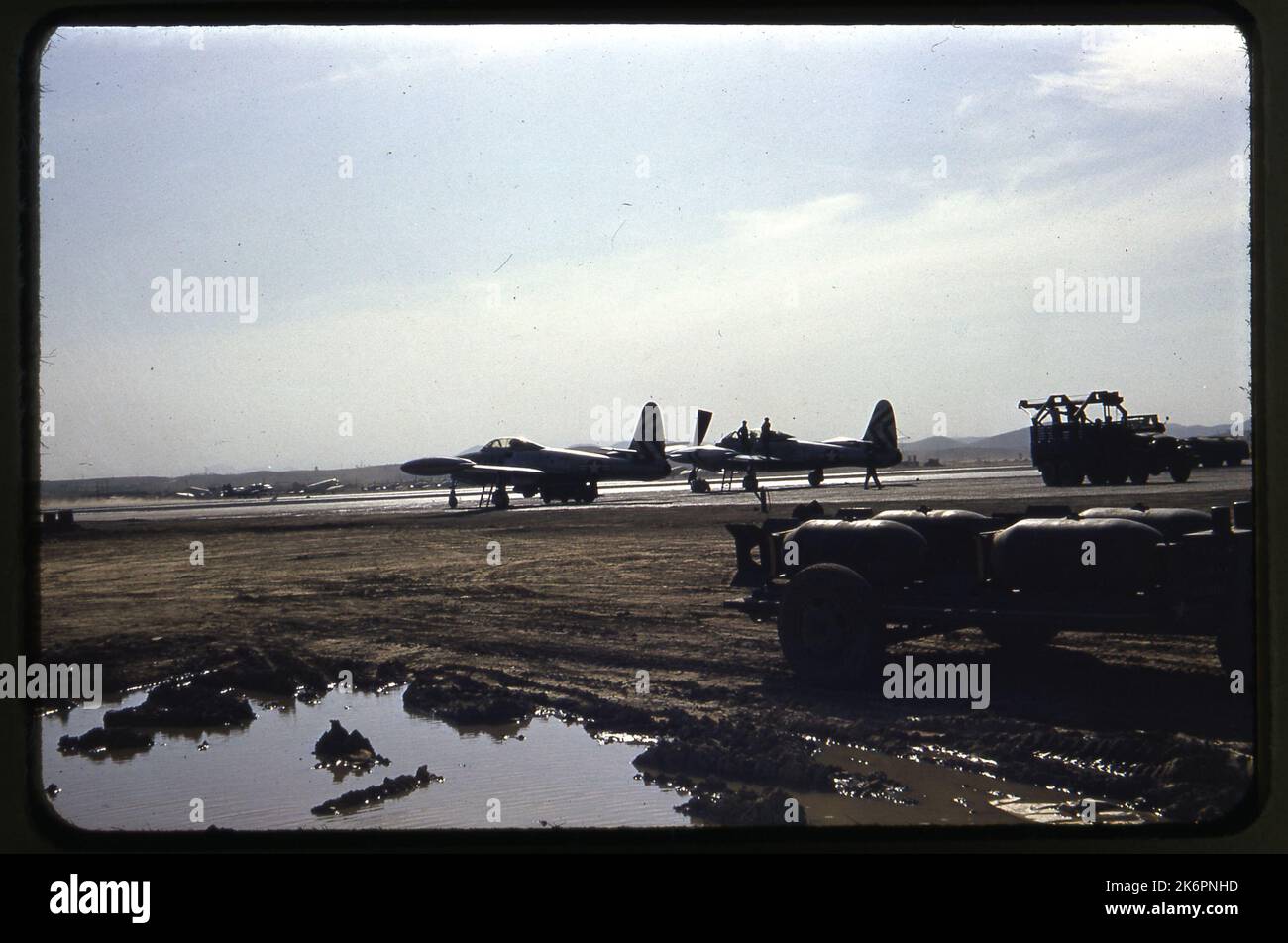 One-half left rear view of two Republic F-84E Thunderjets bearing the ...