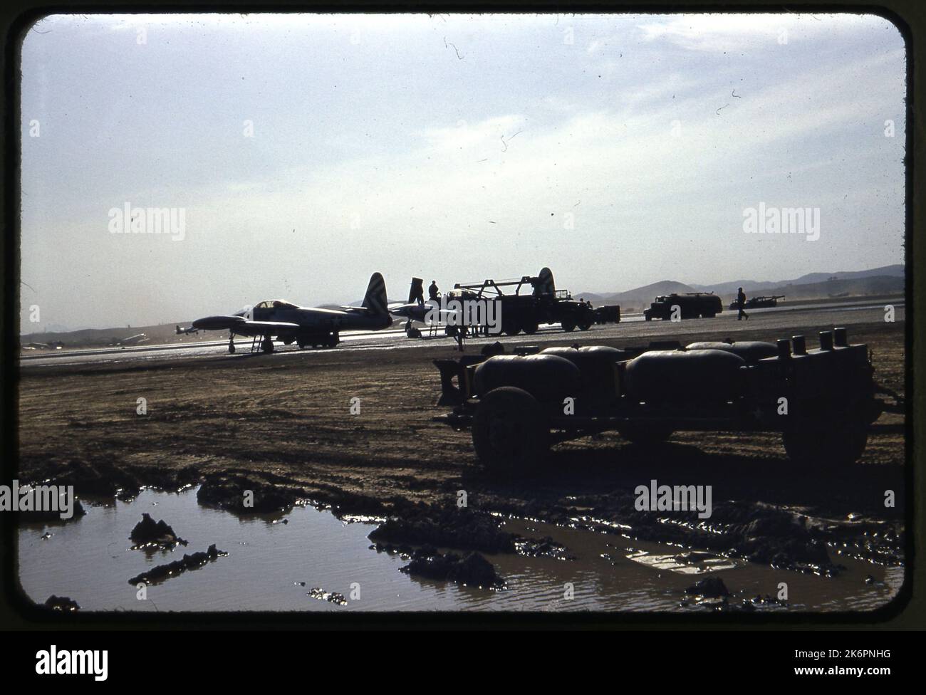 One-quarter left rear view of two Republic F-84E Thunderjets bearing ...