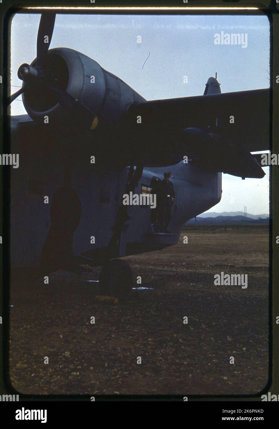 One-half left front view of the wing, engine, rear fuselage and tail of ...