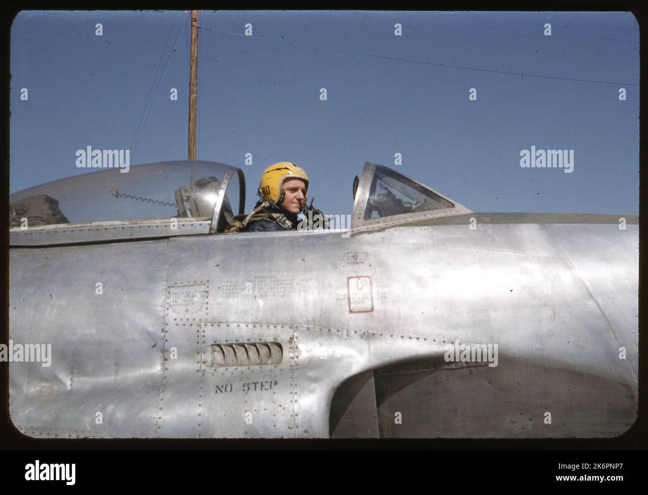 Right side view of a pilot seated in the cockpit of a Lockheed F-80C ...